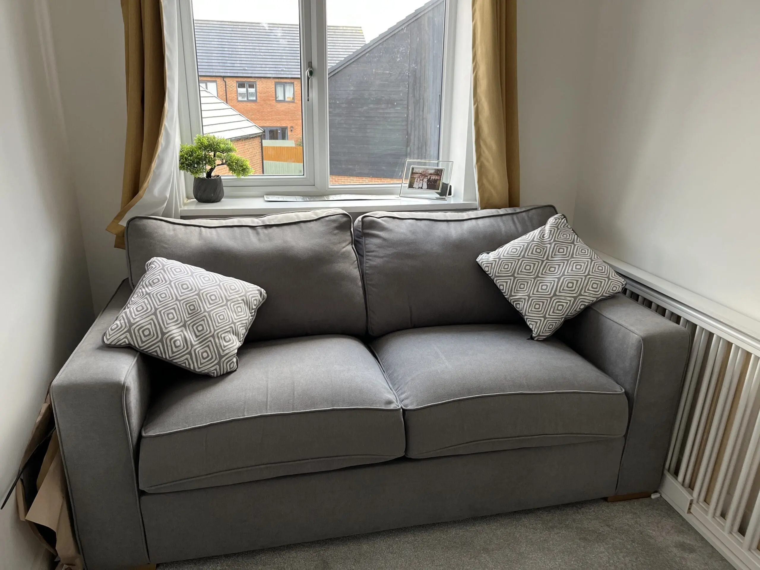 2 seater sofa bed hardly used